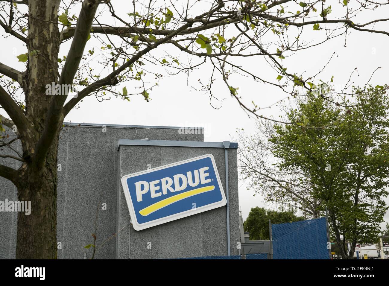 A logo sign outside of a Perdue Farms poultry processing plant in ...