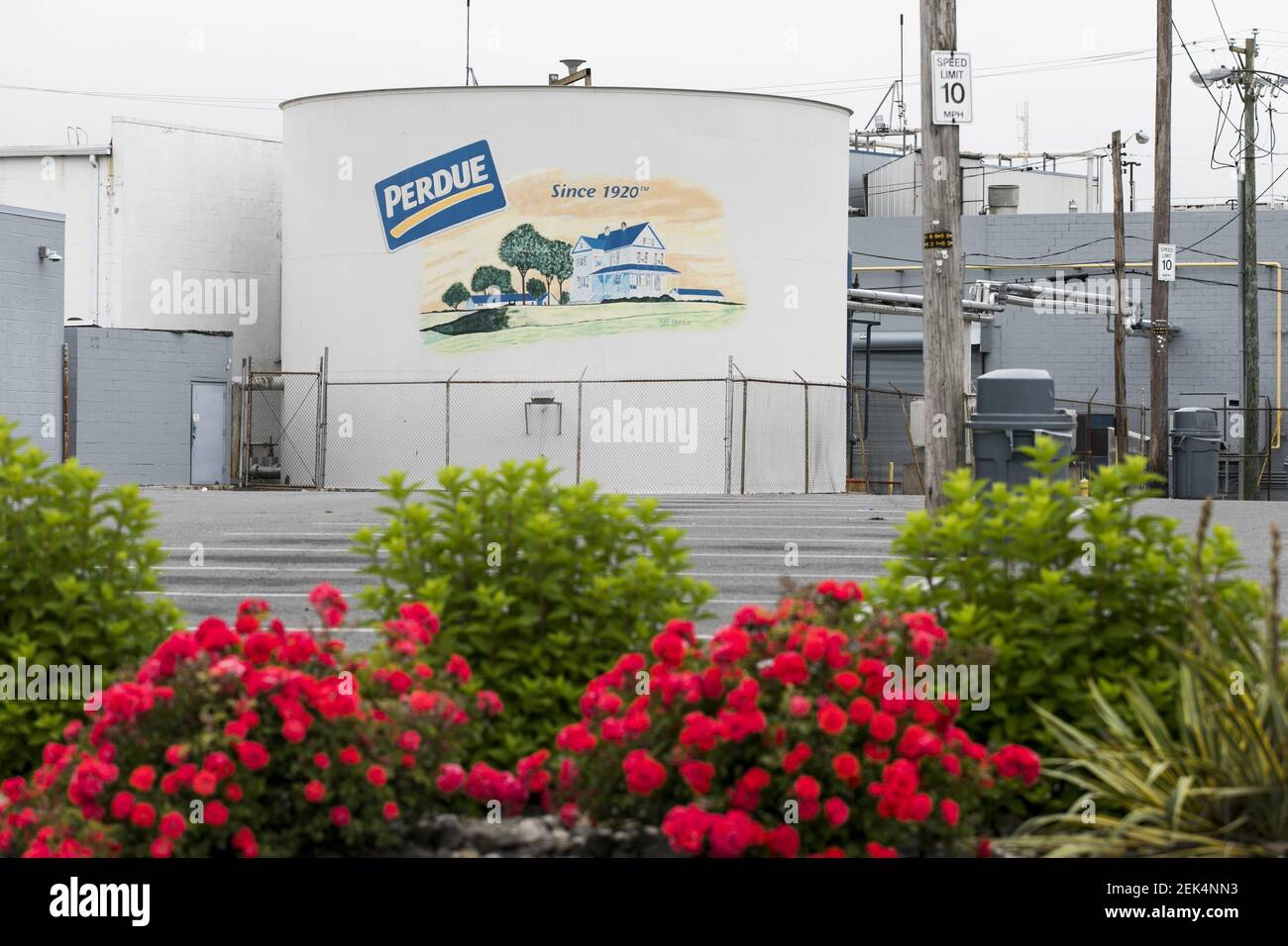 A logo sign outside of a Perdue Farms poultry processing plant in ...