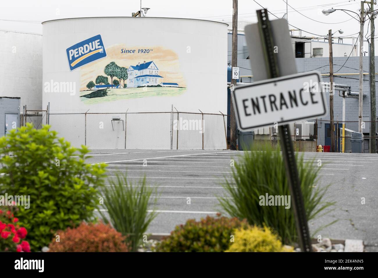 A logo sign outside of a Perdue Farms poultry processing plant in ...