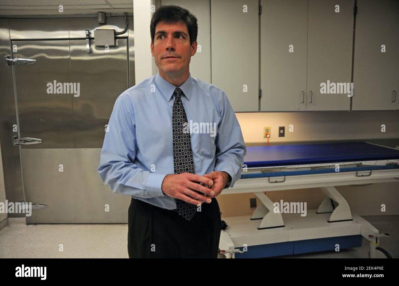 Dr. Andrew Baker, the Hennepin County, Minn., medical examiner, shown ...
