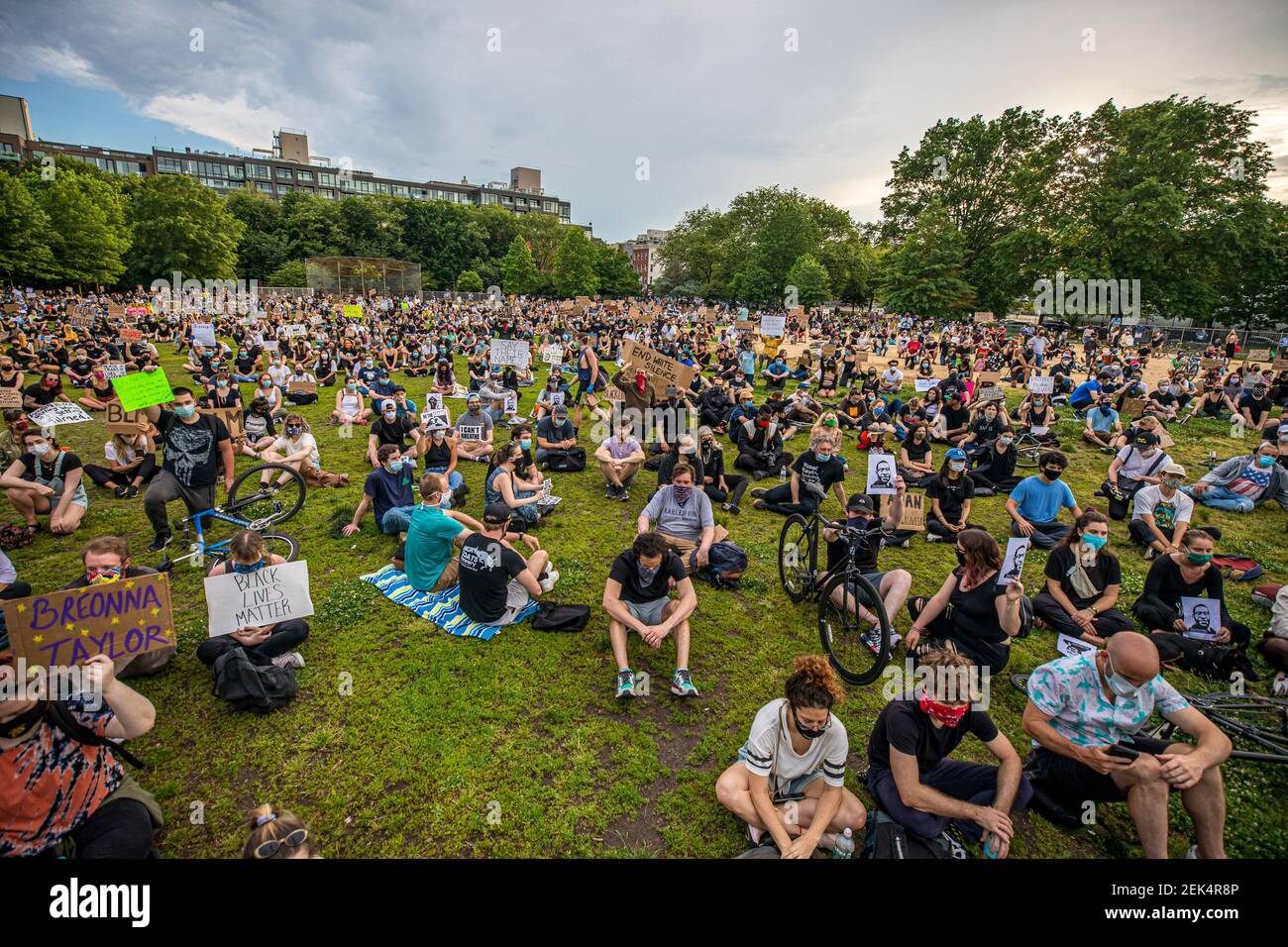 People participate in a peaceful protest in Brooklyn's McCarren Park ...