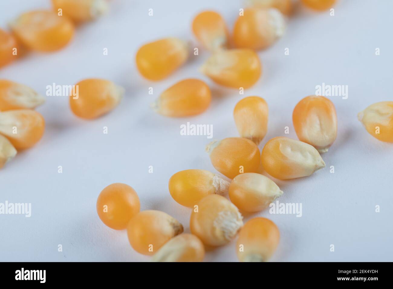 Heap of raw popcorn grains texture background Stock Photo - Alamy
