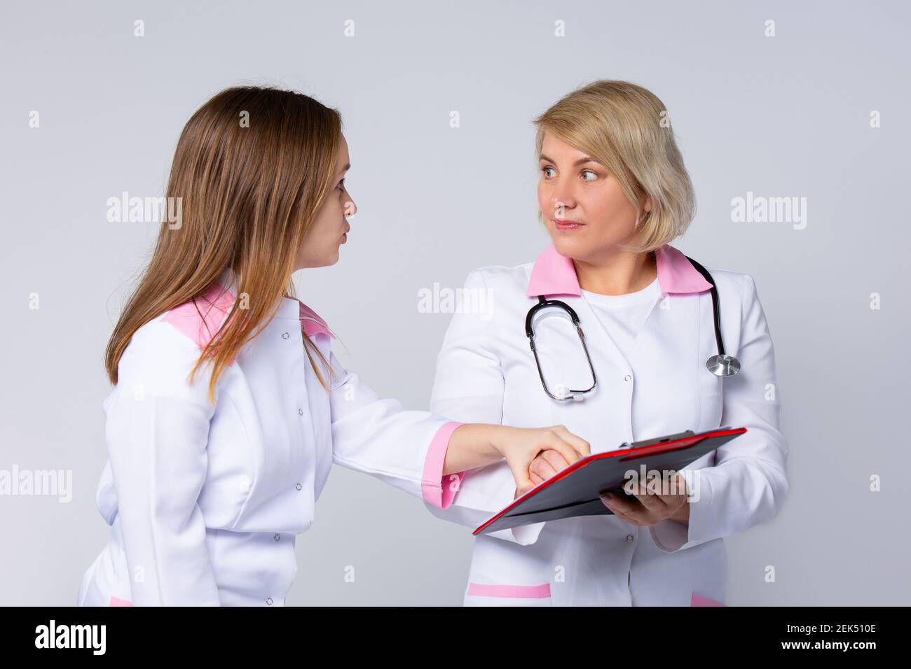Amazed, shocked, dizzy medical doctors are discussing diagnosis during ...