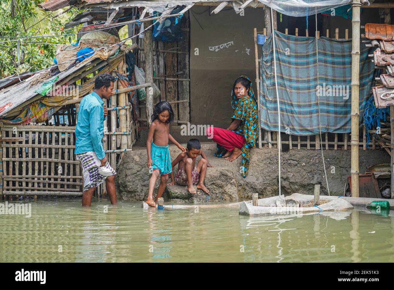 A family stuck at their flooded house after the landfall of cyclone ...