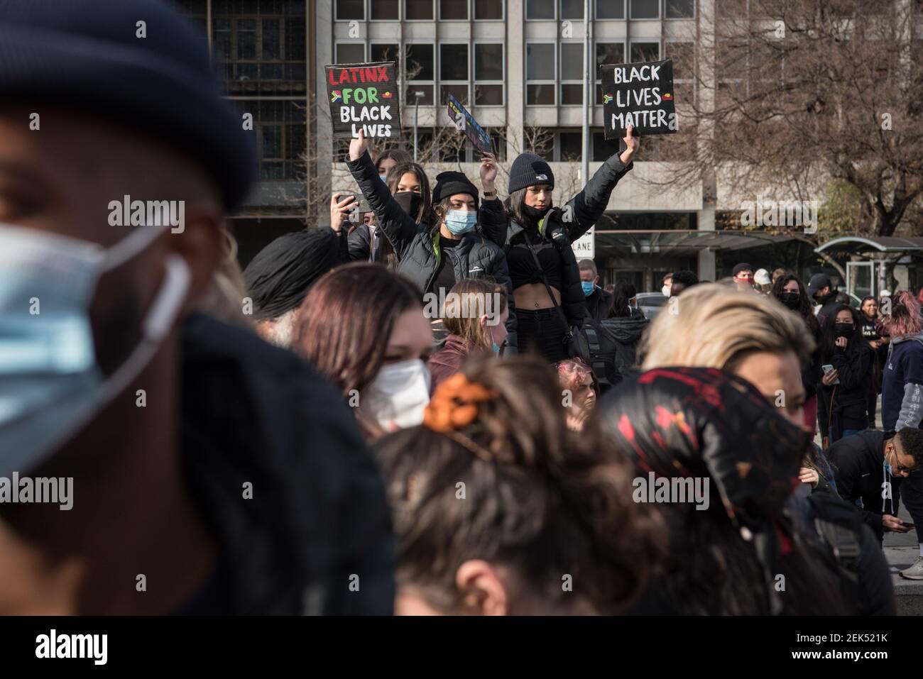 Protesters hold placards during the demonstration. Thousands of ...