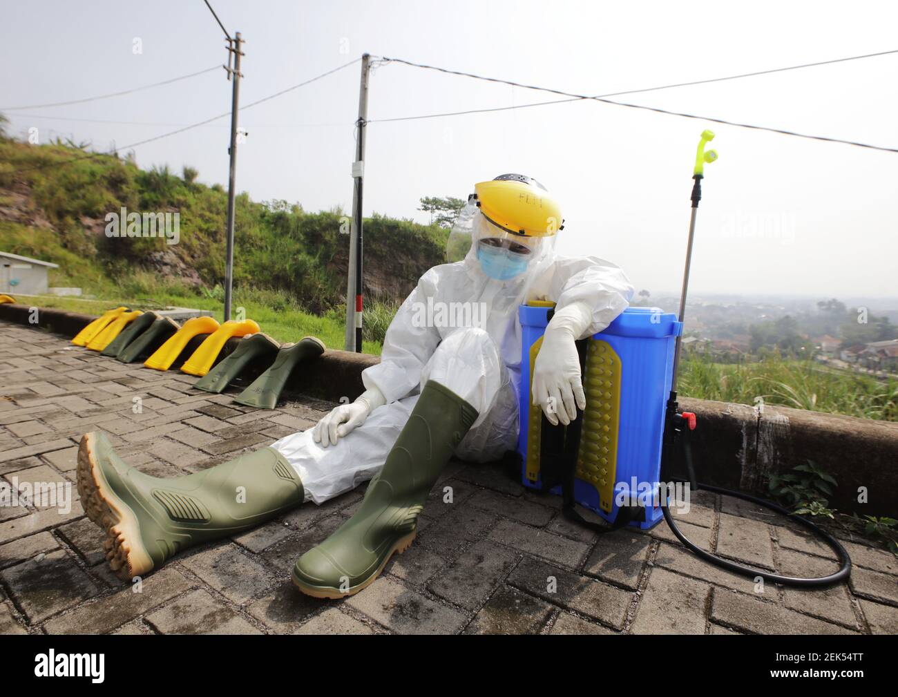 A worker wear face shield and protective gear as a preventive measure ...