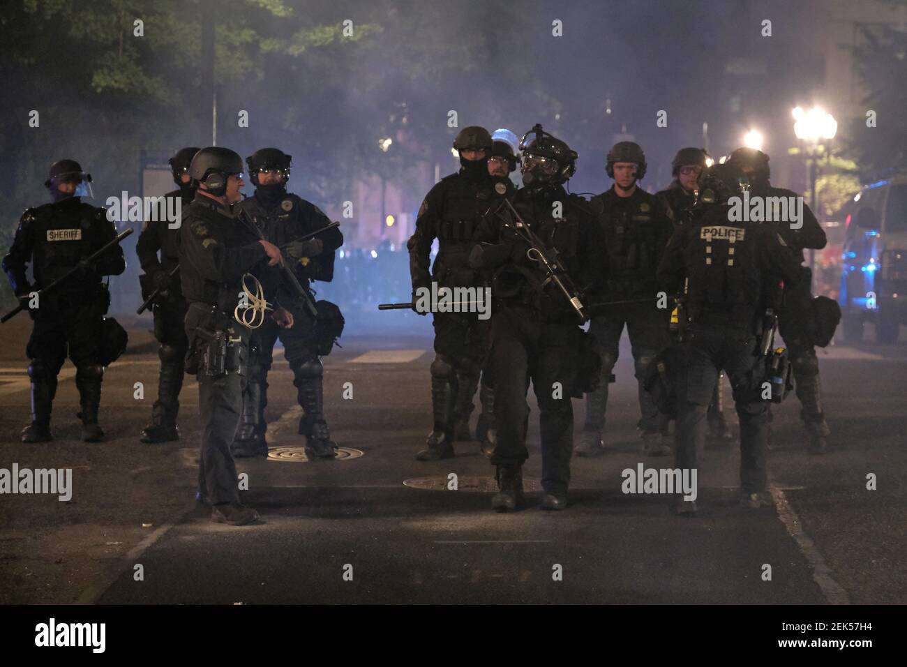 Police clear the streets around the Justice Center using crowd control ...