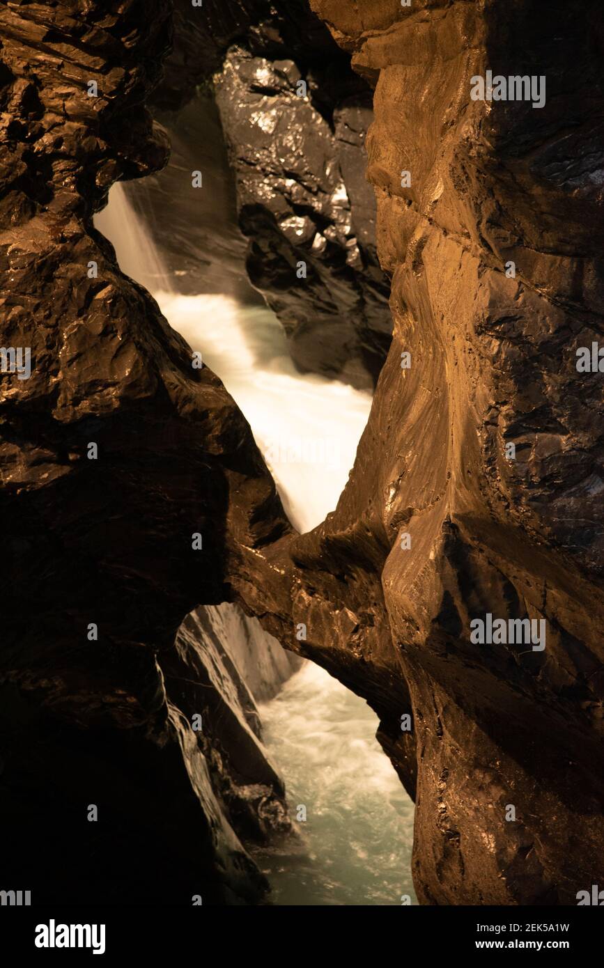 Flowing water of a waterfall inside a mountain Stock Photo - Alamy