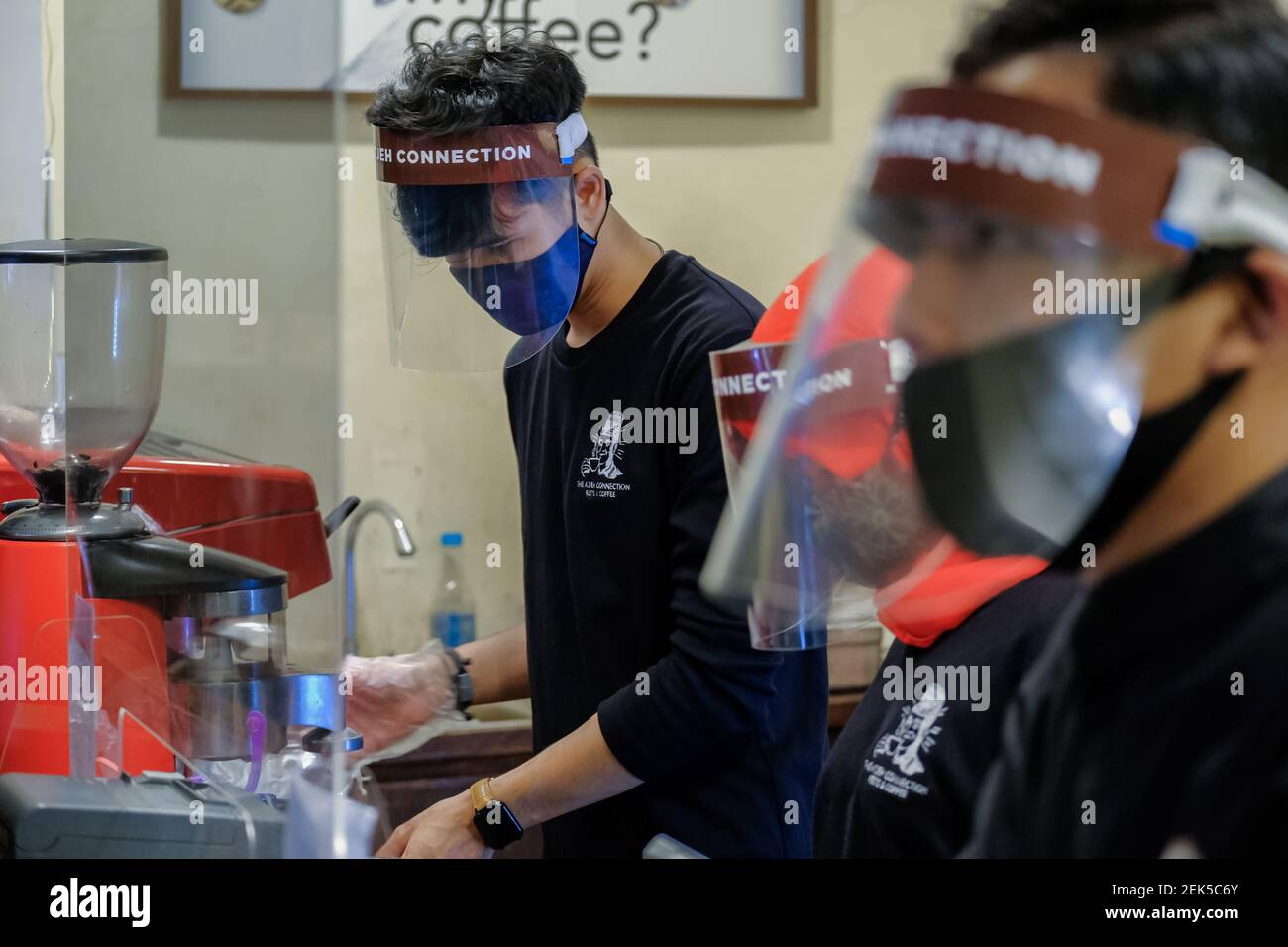 Customers dines in behind an acrylic separator at the Atjeh Connection ...