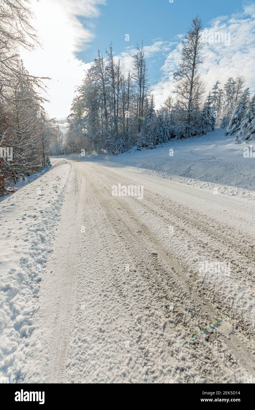 Slippery frosty road in snowy mountain in winters; France Stock Photo ...