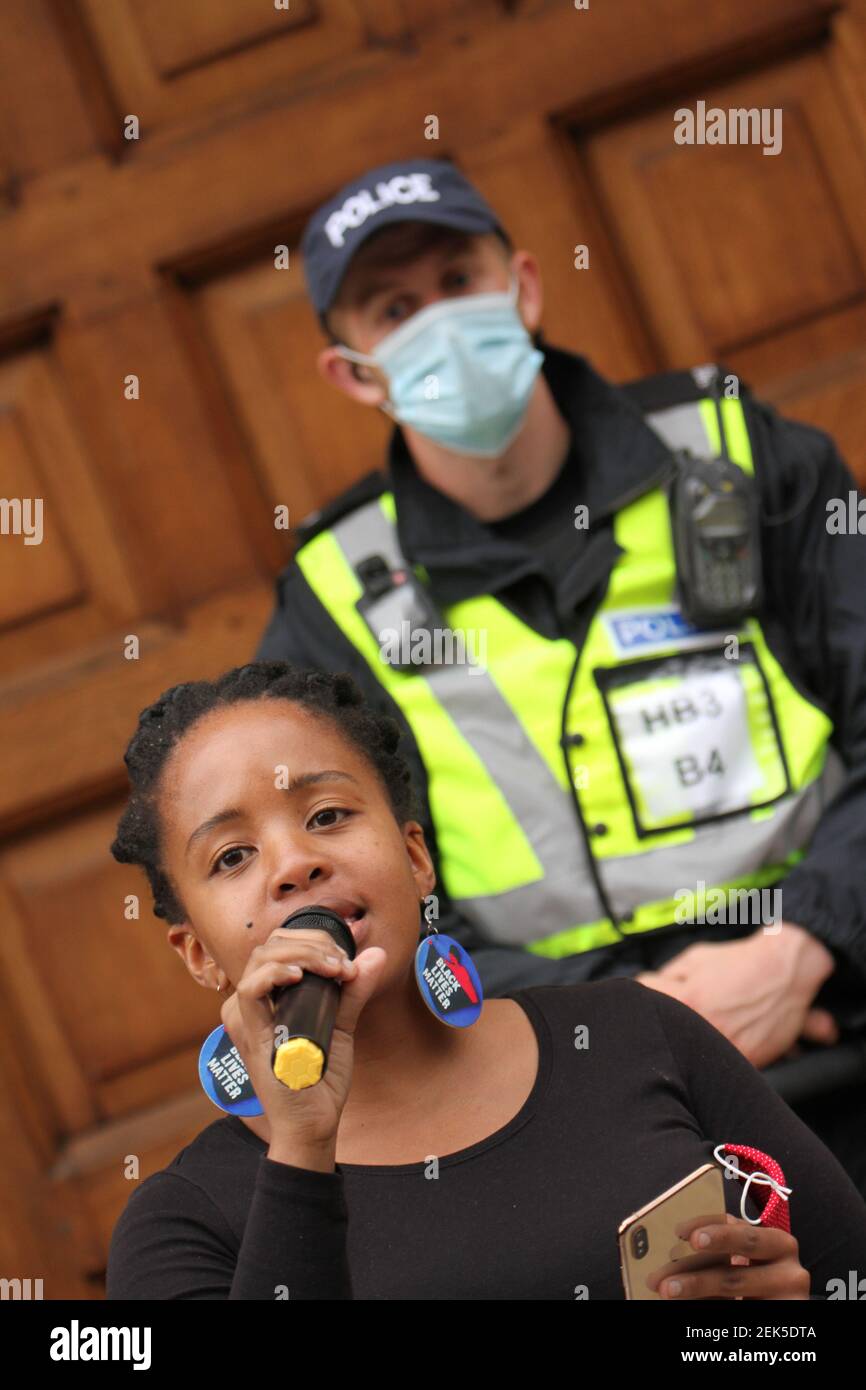 An activist addresses a crowd of protesters during the demonstration ...