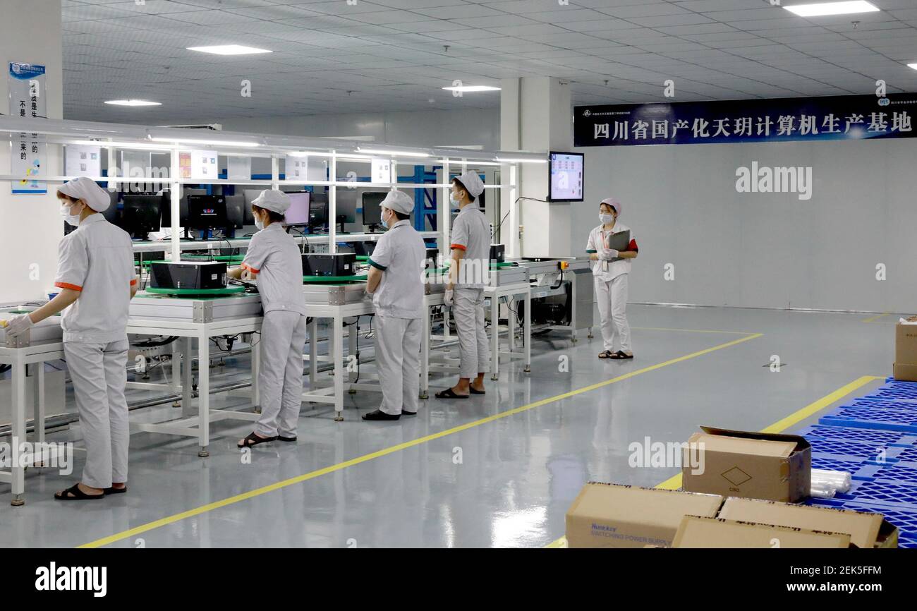 Workers are busy at assembling purely domestic computer, whose hardware ...