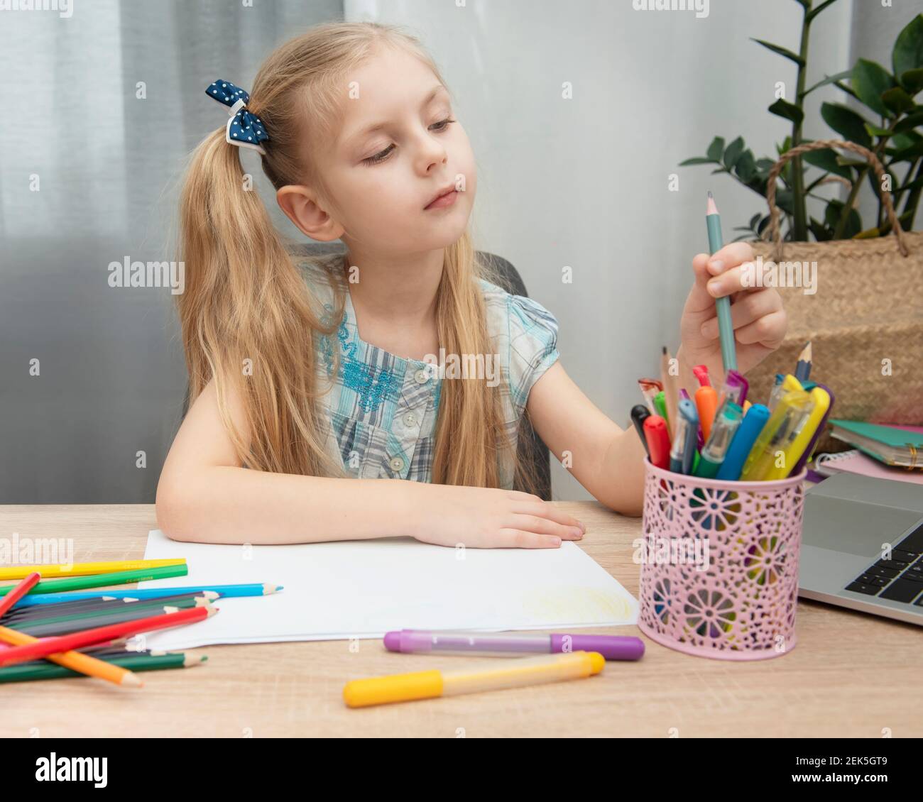 Cute girl doing homework in her room at home Stock Photo - Alamy