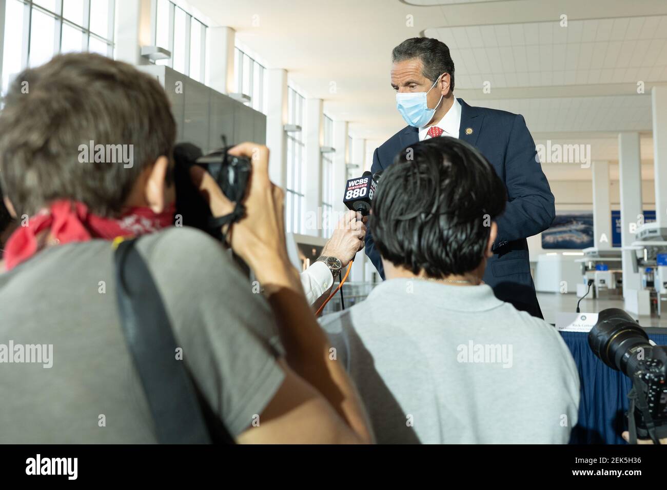 New York Governor, Andrew Cuomo speaks while wearing a face mask during ...