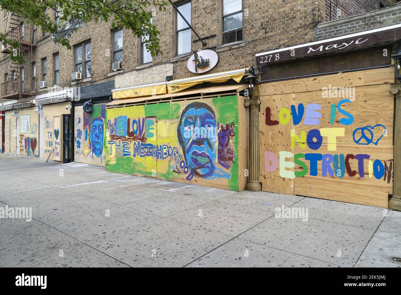 Local graffiti artists painted murals on boarded storefronts for ...