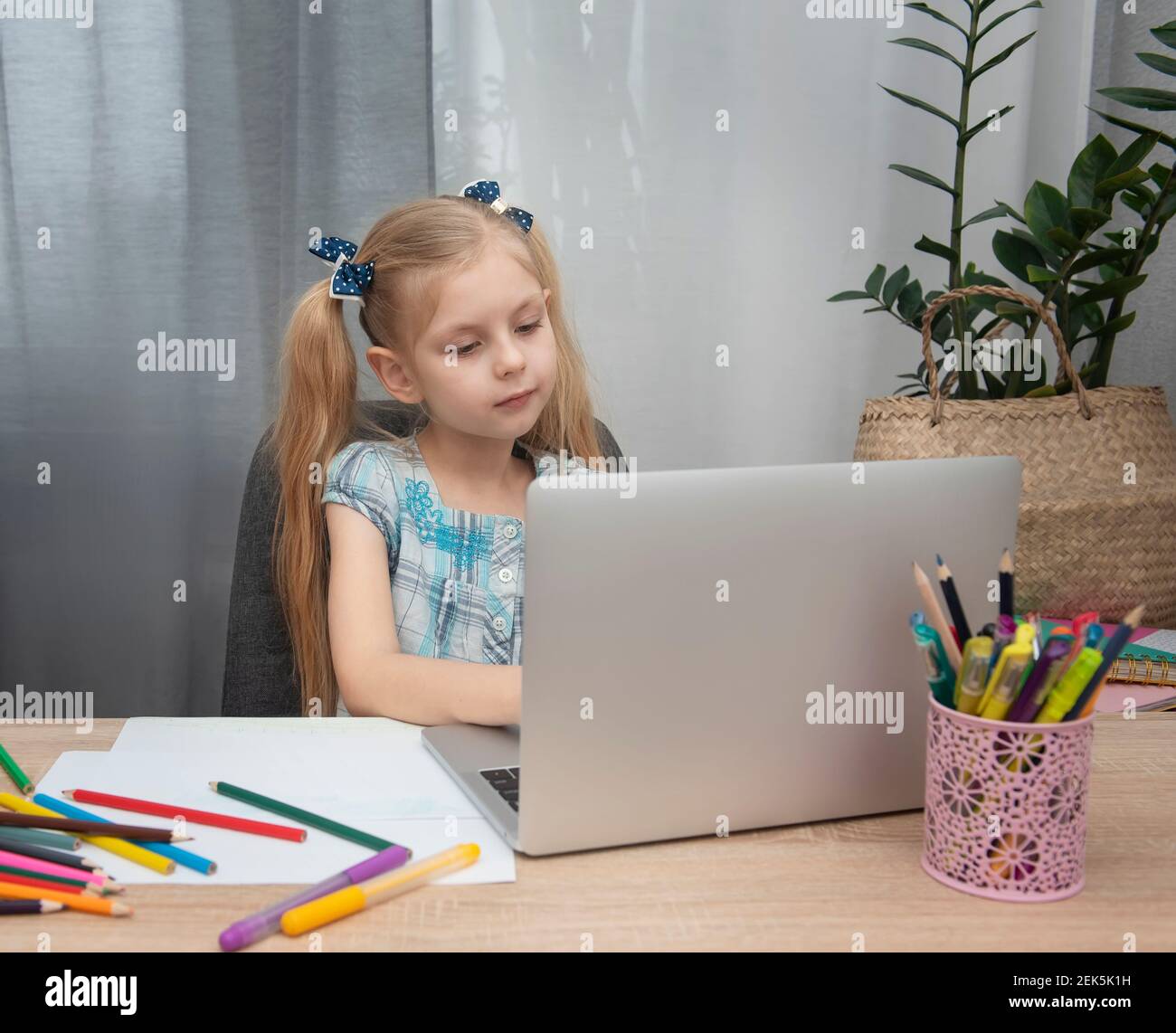 Cute girl doing homework in her room at home Stock Photo - Alamy