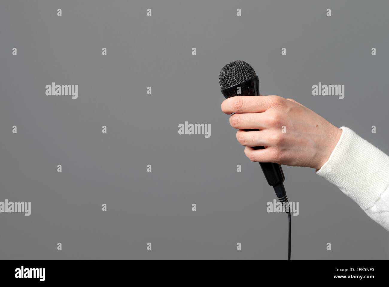 Female journalist holding microphone hi-res stock photography and ...