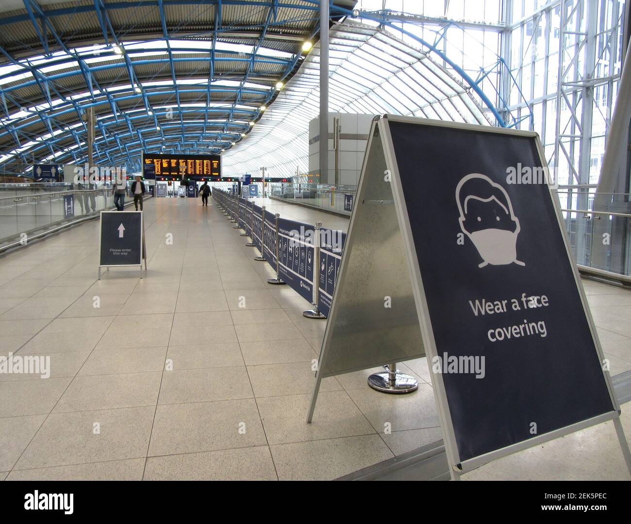 Wear a Face covering notice is seen at London Waterloo station. COVID ...
