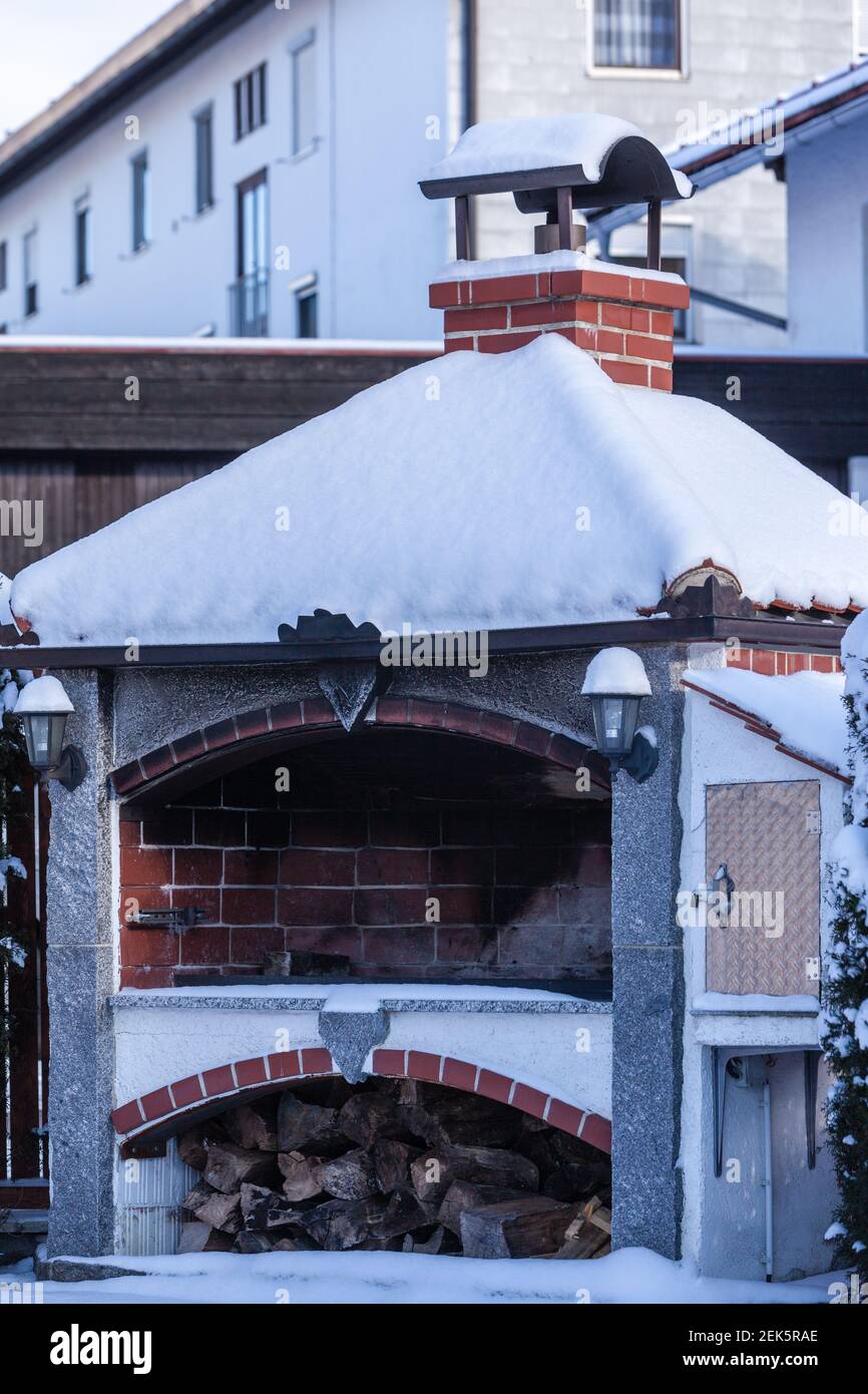 Large brick barbecue with fireplace and snow-covered Stock Photo - Alamy