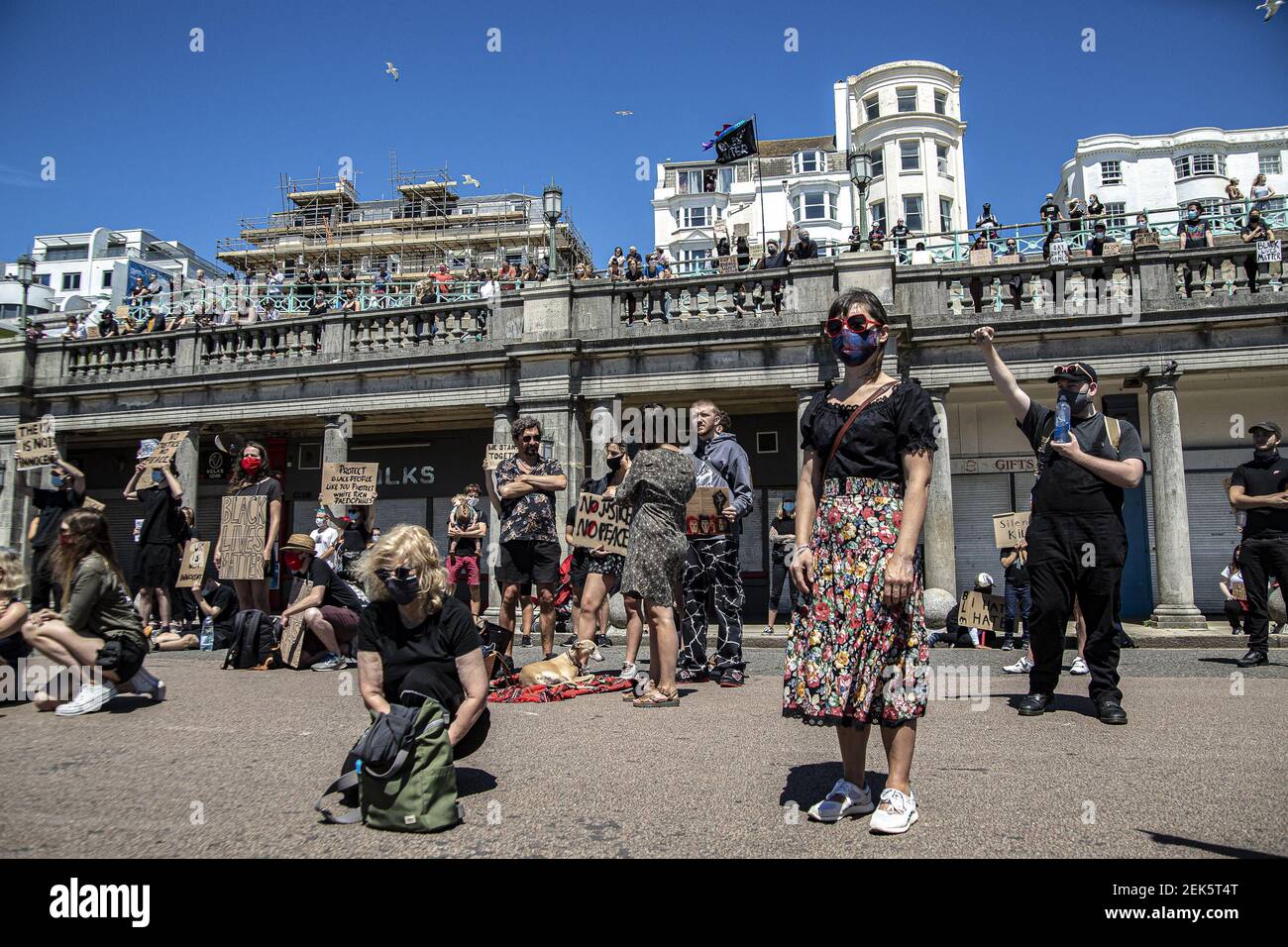 Young people are seen on the seafront during the BLM silent protest in ...