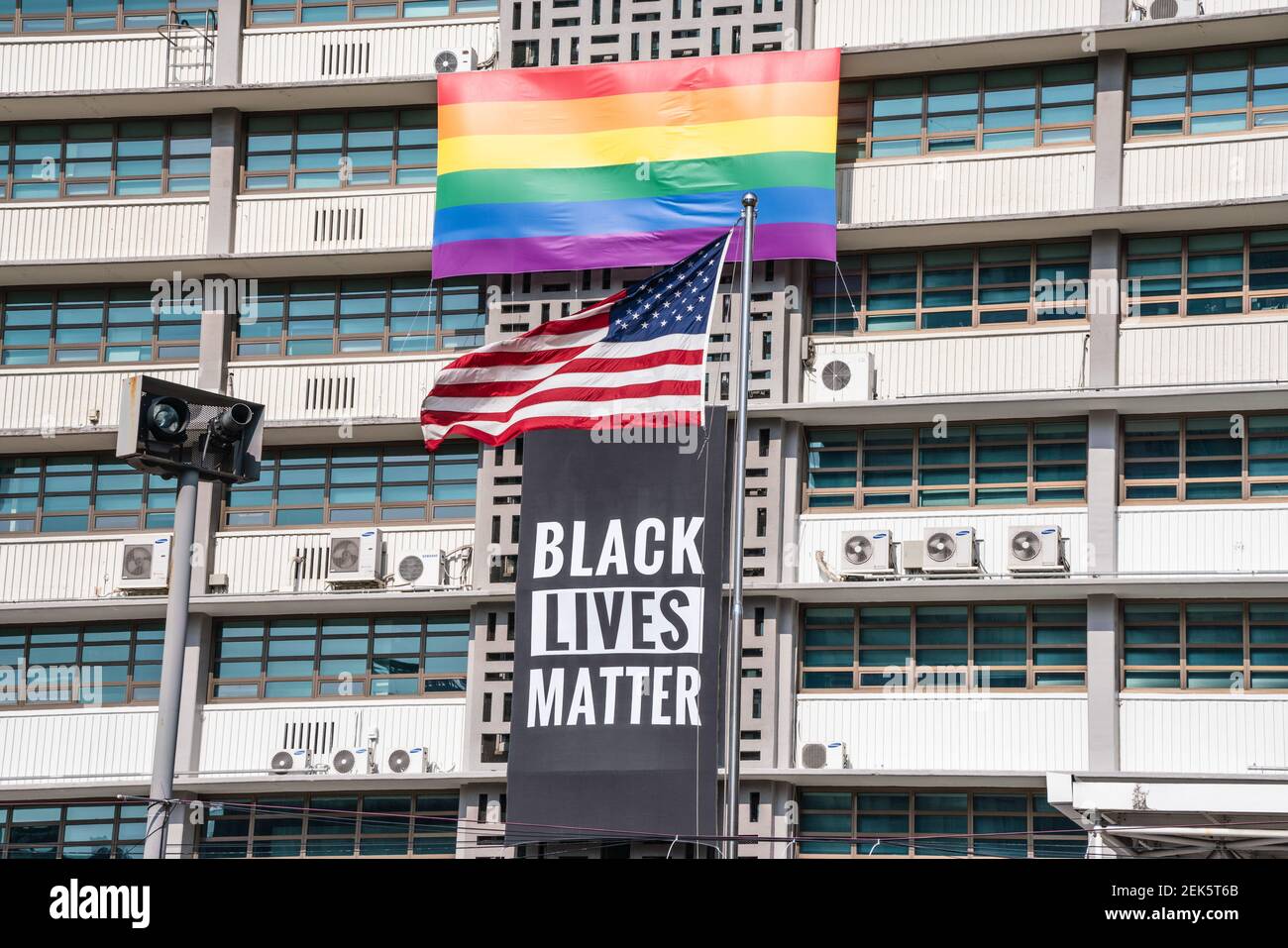 A Black Lives Matter banner, a United States national flag and a ...