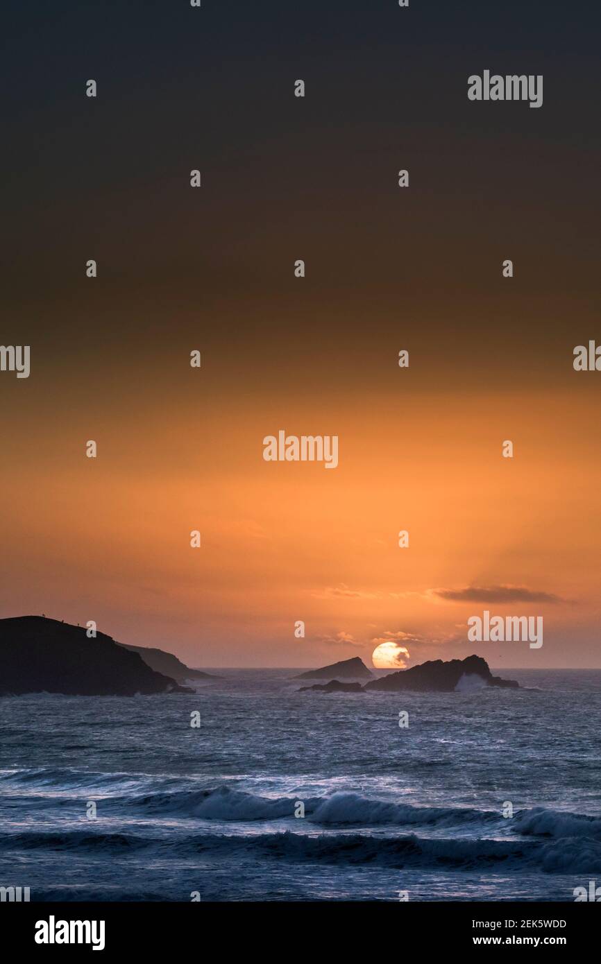 An intense spectacular sunset over Fistral Bay in Newquay in Cornwall ...