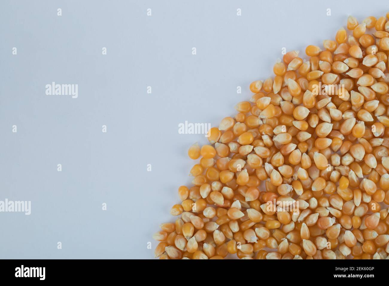 Heap of raw popcorn grains texture background Stock Photo - Alamy