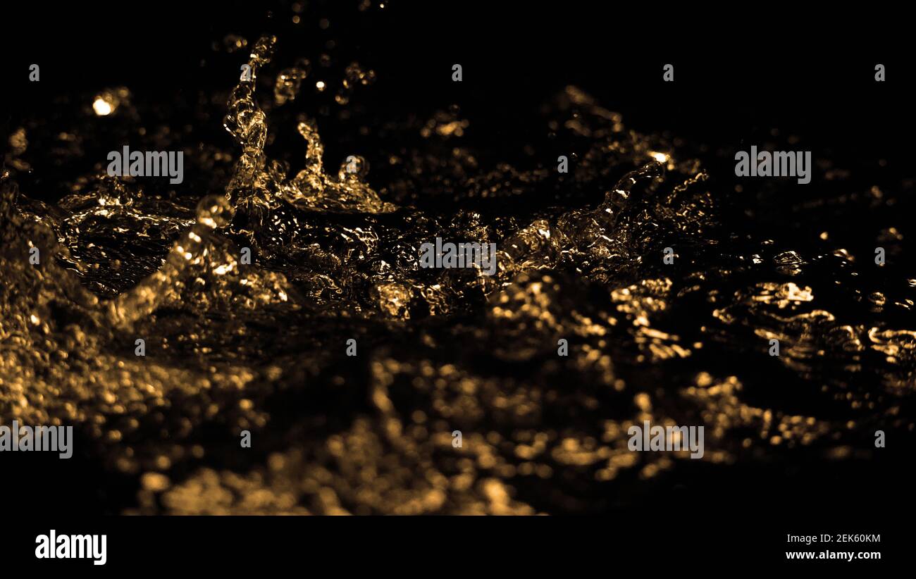 Hi speed close up images of oil liquid from diesel gasoline splashing ...