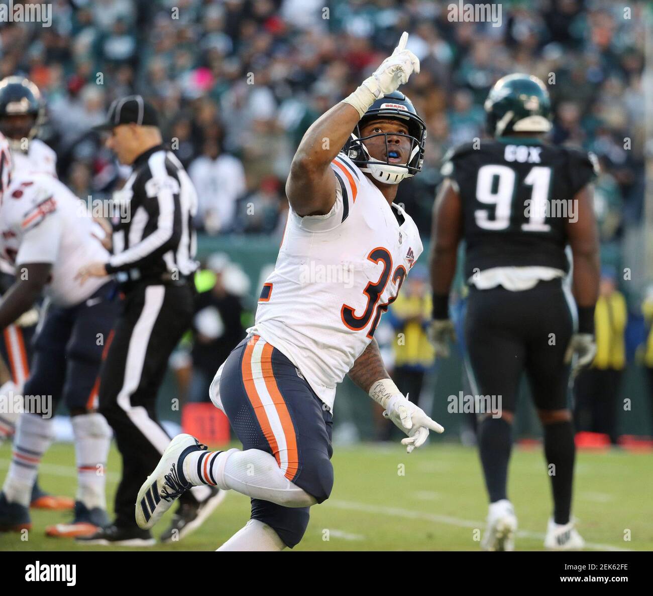 Bears running back David Montgomery points to the sky after scoring a touchdown in the fourth ...