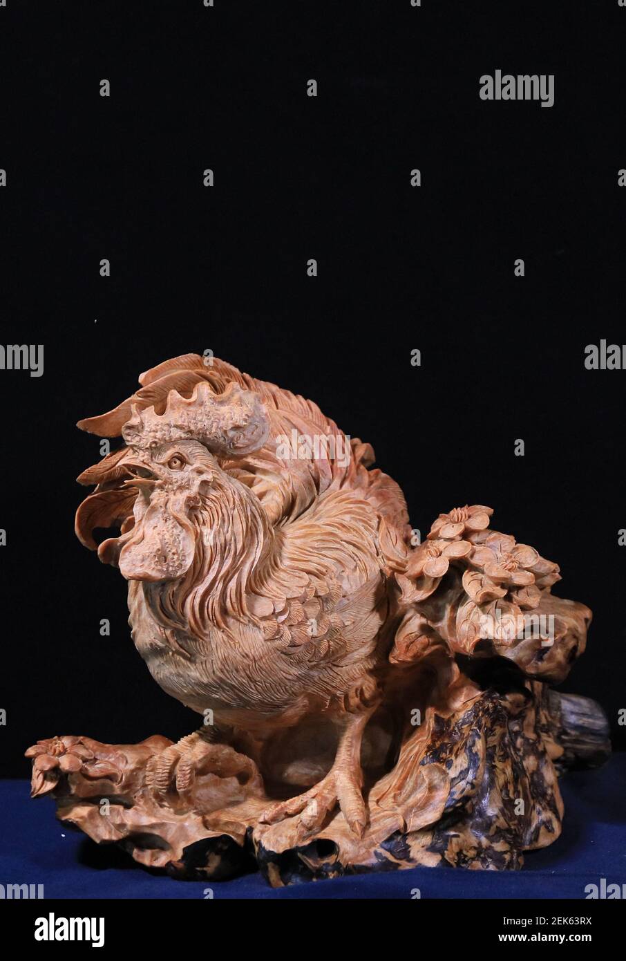 Agarwood sculptures are demonstrated at a local factory, Yichun city ...