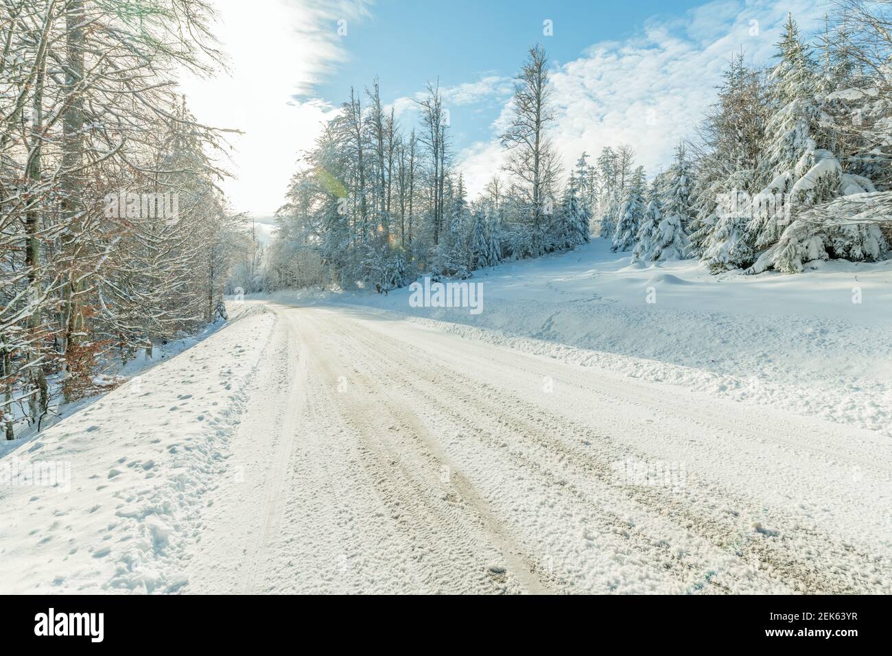 Slippery frosty road in snowy mountain in winters; France Stock Photo ...
