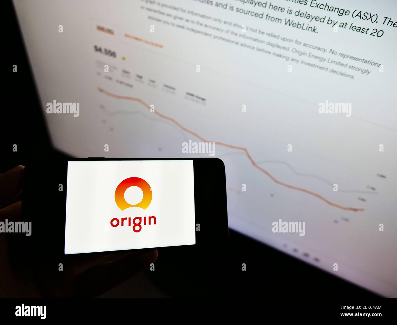 Person holding cellphone with logo of Australian energy company Origin ...