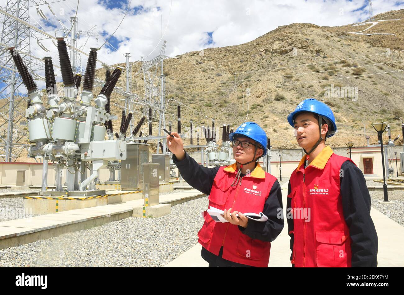 SHANNAN, CHINA - JUNE 17, 2020 - Members of the State Grid patrol the ...