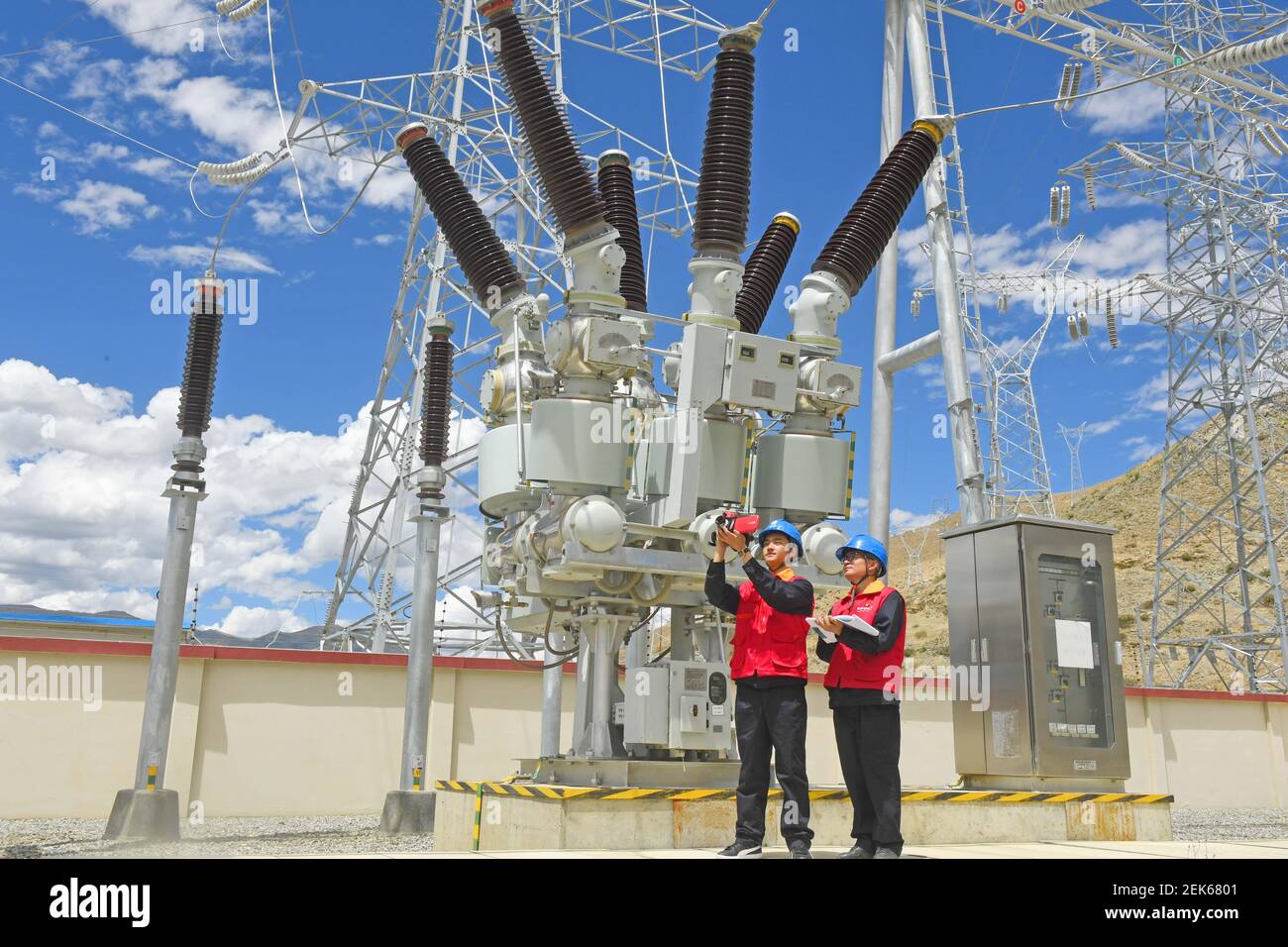 SHANNAN, CHINA - JUNE 17, 2020 - Members of the State Grid patrol the ...