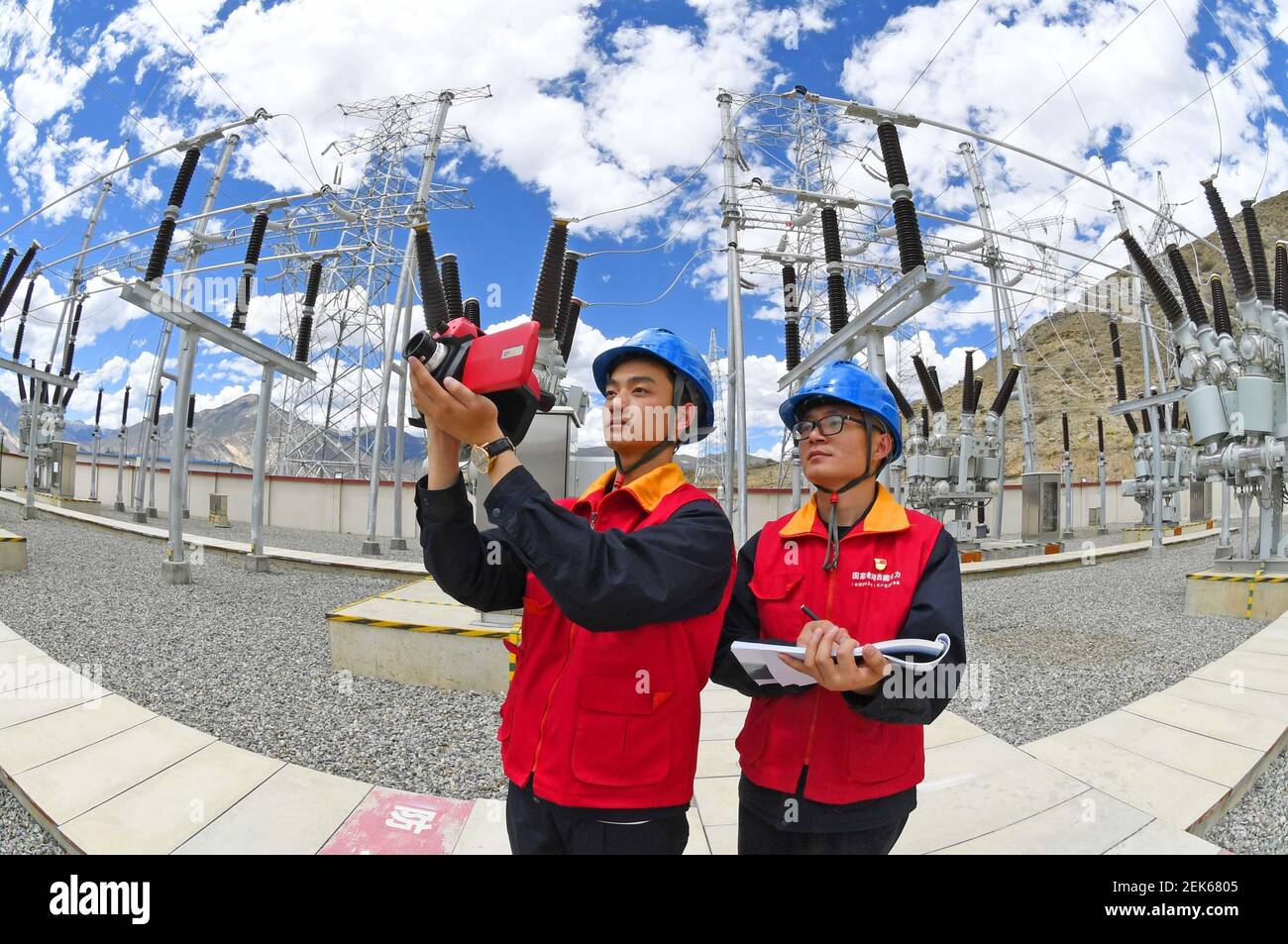 SHANNAN, CHINA - JUNE 17, 2020 - Members of the State Grid patrol the ...