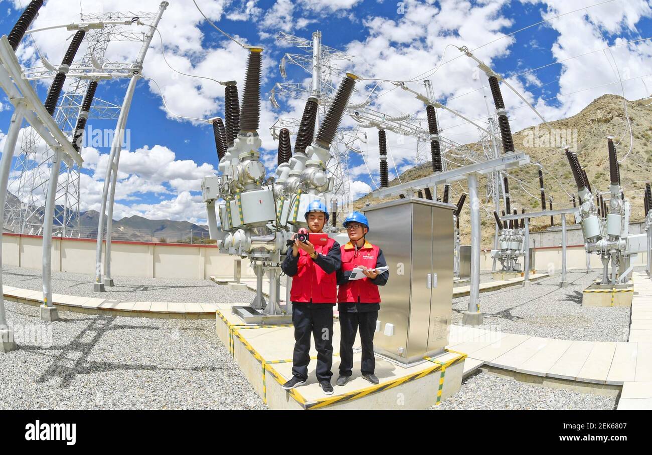 SHANNAN, CHINA - JUNE 17, 2020 - Members of the State Grid patrol the ...
