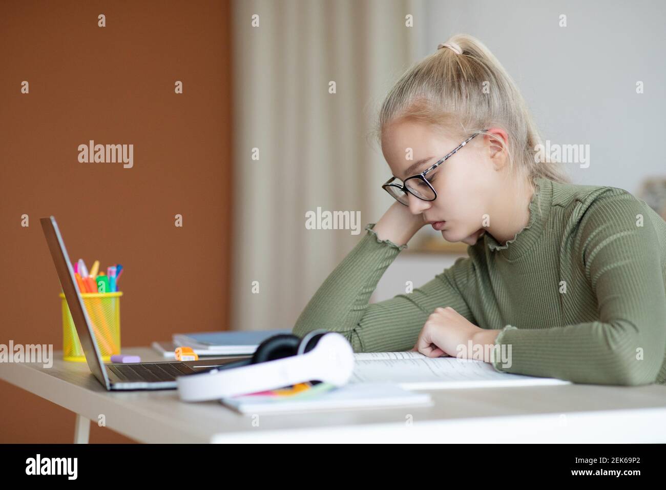 Bored teen girl table hi-res stock photography and images - Alamy