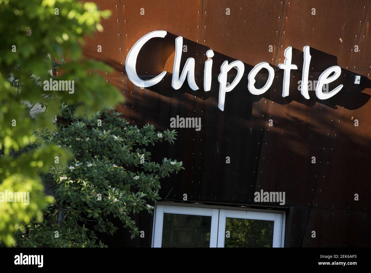 A logo sign outside of a Chipotle restaurant location in Bowie ...