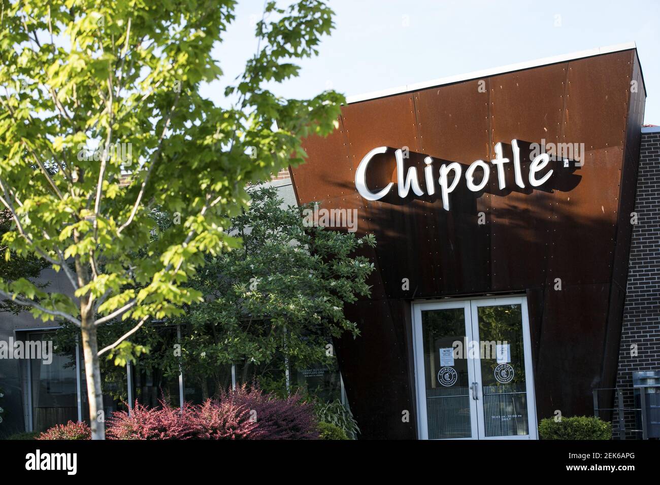 A logo sign outside of a Chipotle restaurant location in Bowie ...
