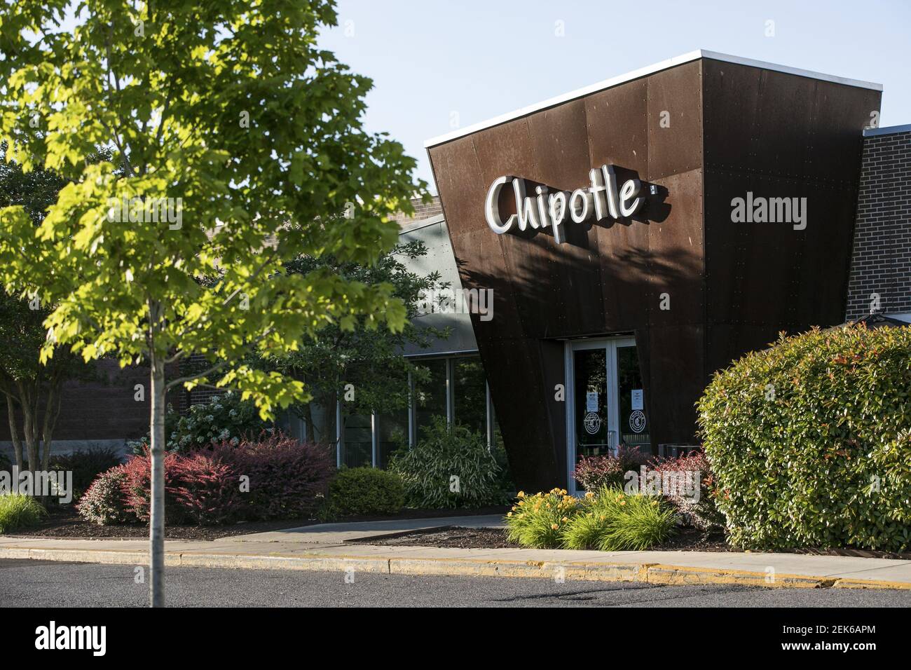 A logo sign outside of a Chipotle restaurant location in Bowie ...
