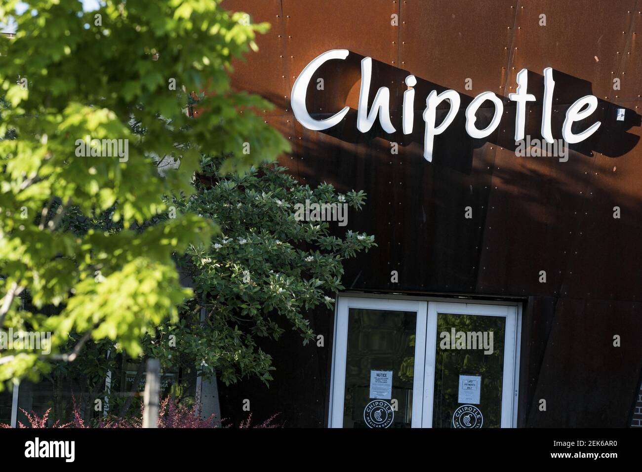 A logo sign outside of a Chipotle restaurant location in Bowie ...