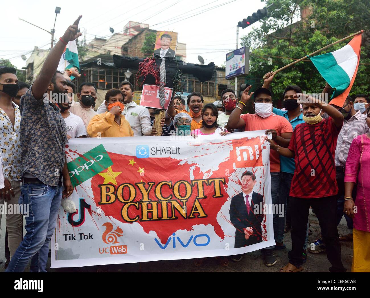 Protesters hold a banner while chanting slogans during the ...
