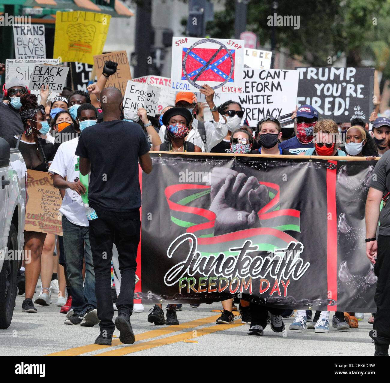 Demonstrators march on Livingston Street from Lake Eola Park in ...