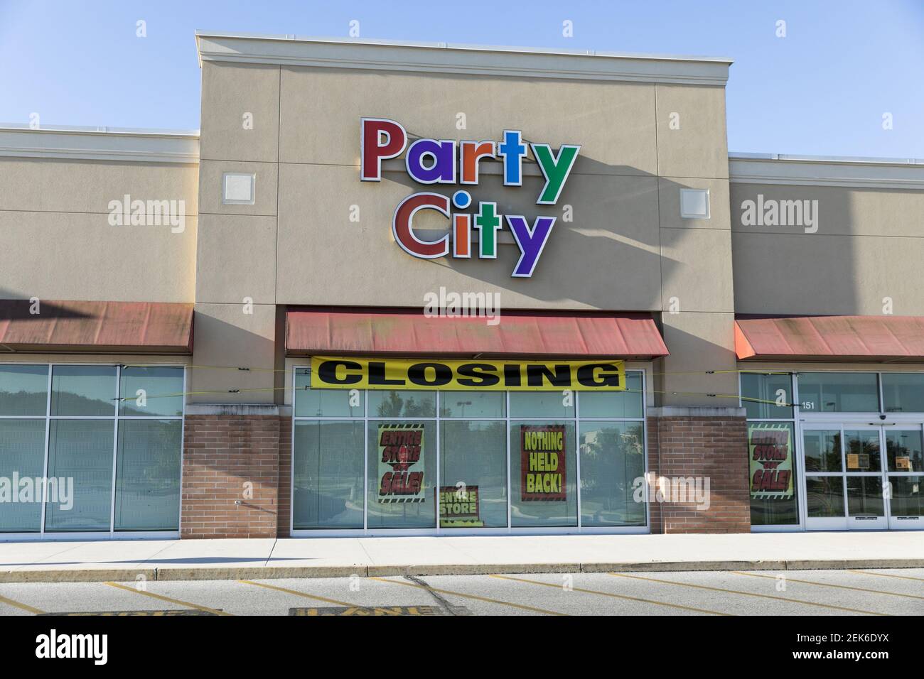 'Store Closing' signage outside of a Party City retail store location ...