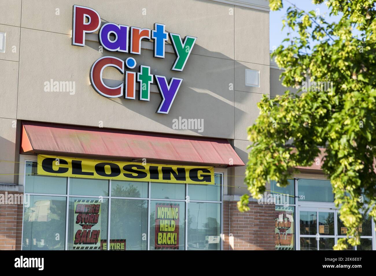 'Store Closing' signage outside of a Party City retail store location ...