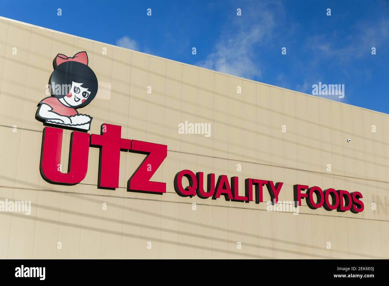 A logo sign outside of a facility occupied by Utz Quality Foods in ...
