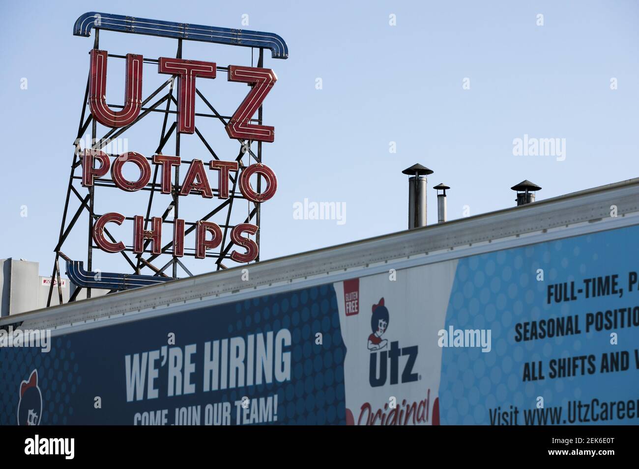 A logo sign outside of a facility occupied by Utz Quality Foods in ...