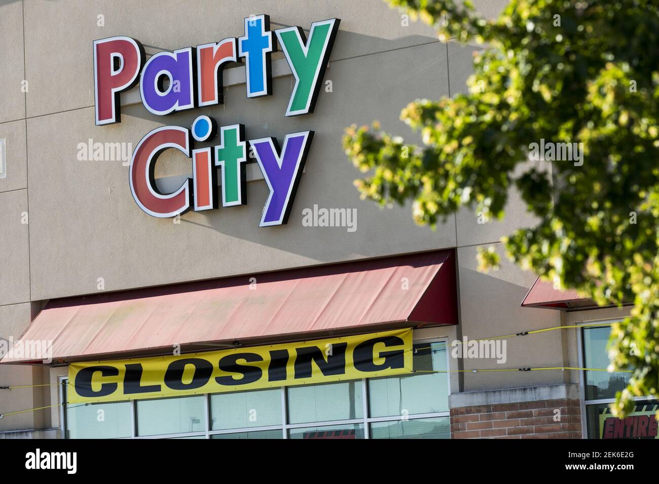 'Store Closing' signage outside of a Party City retail store location ...