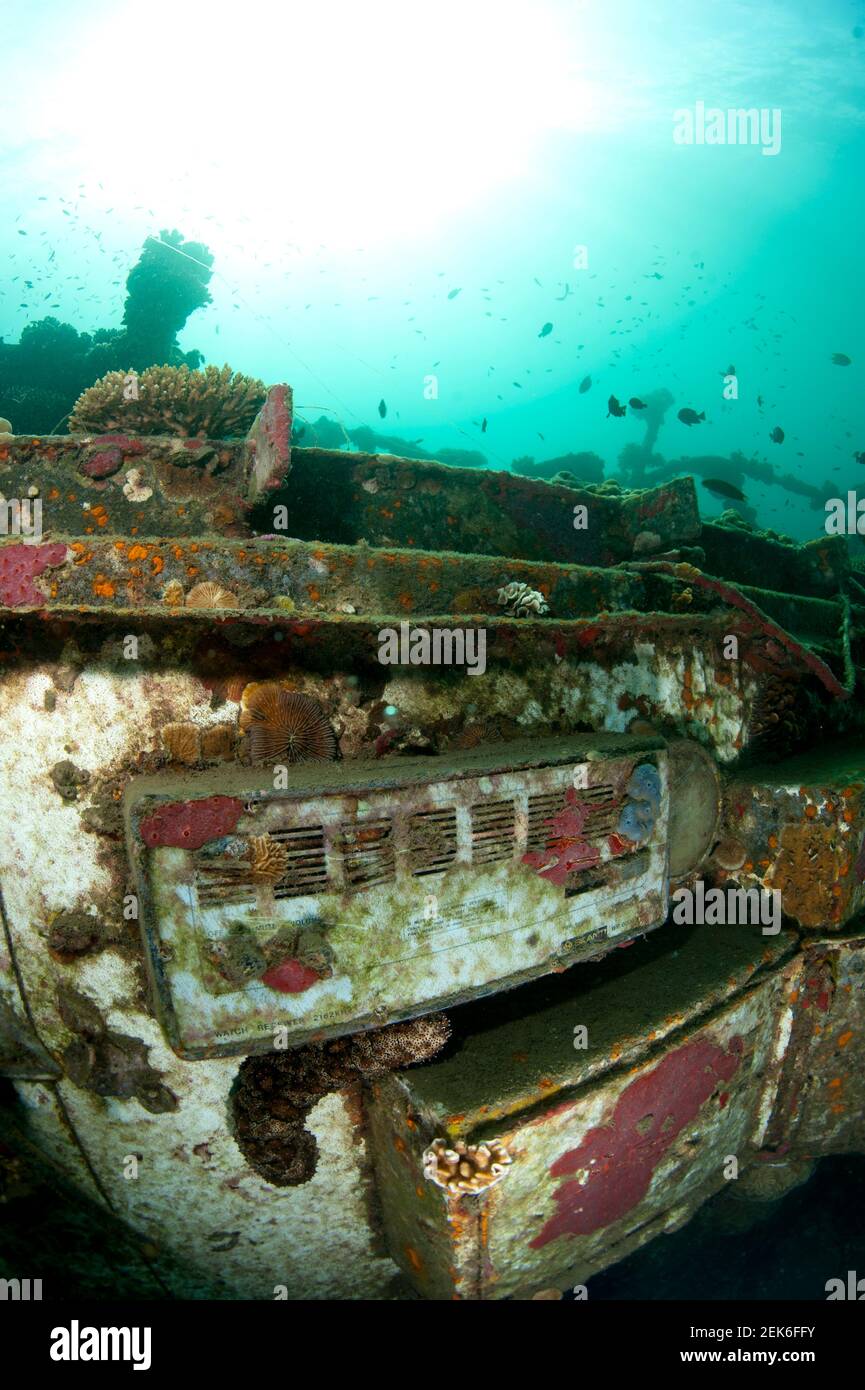 Radio on wreck with sun in background, Tanjung Nabire Dua dive site ...
