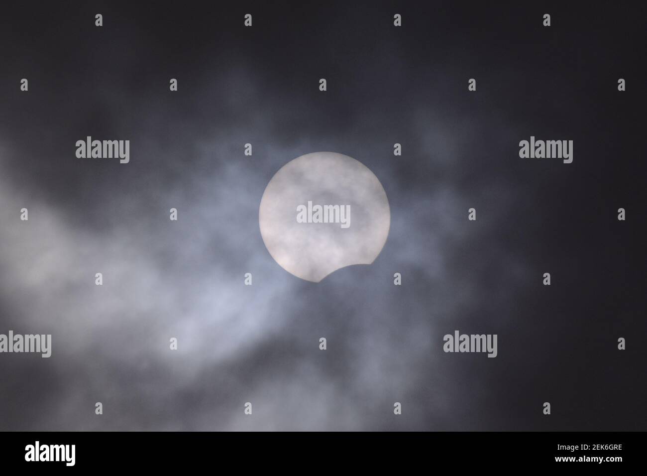 An annular solar eclipse among dark clouds is captured in Guiyang city ...